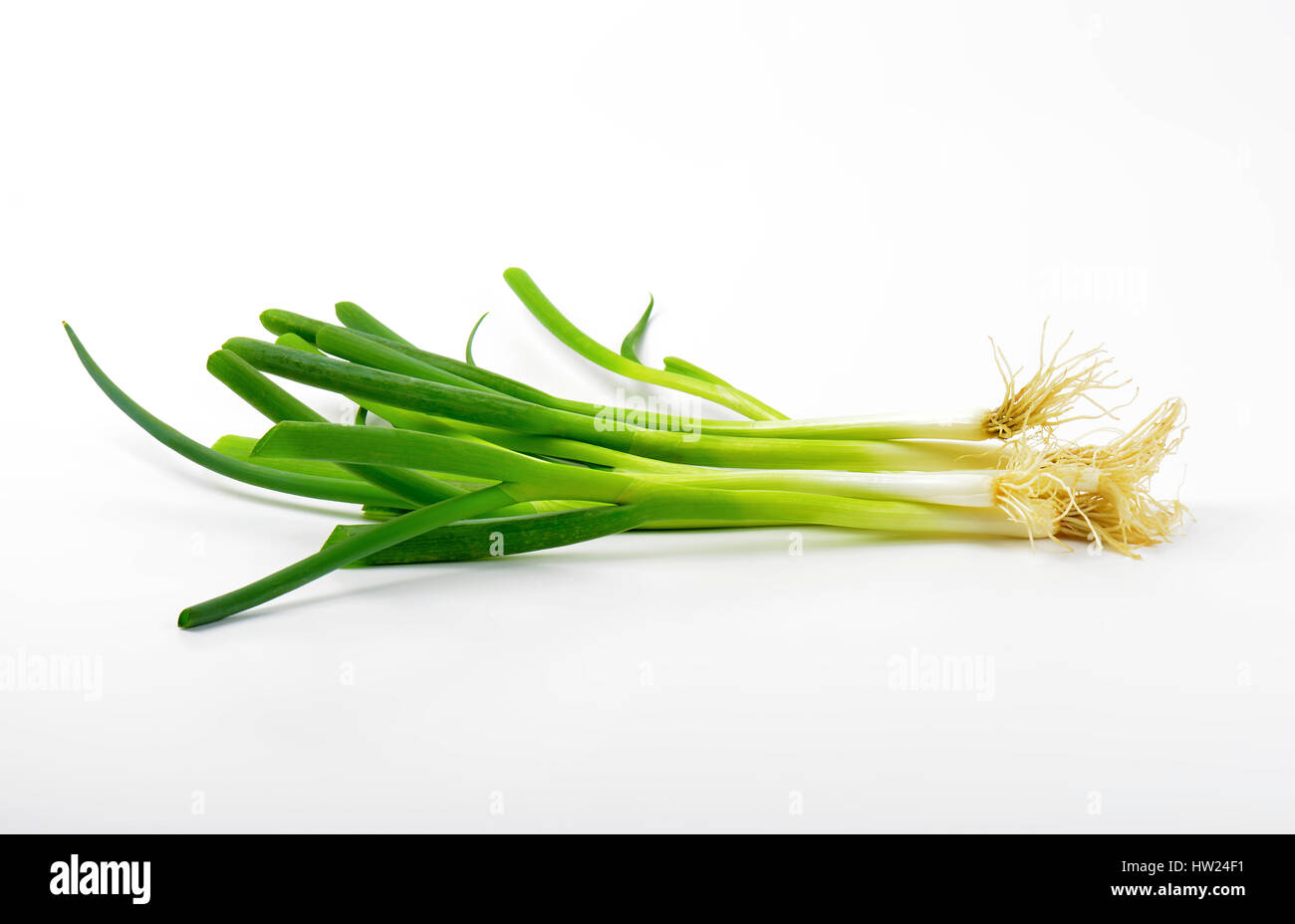 Spring onions (scallions) on white background Stock Photo - Alamy