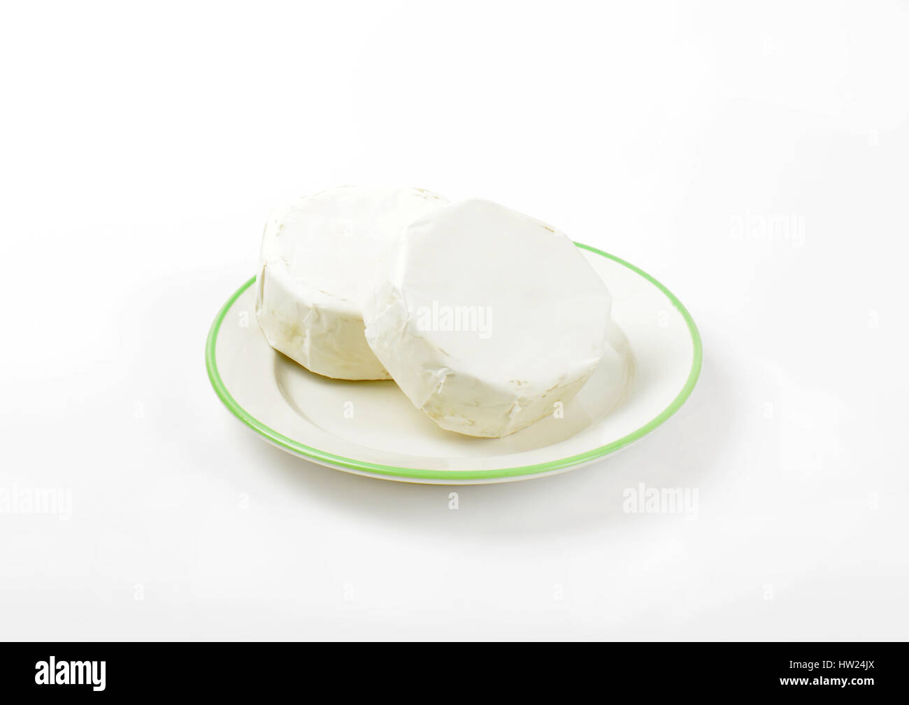 Wheels of soft ripened cheese with white mold rind Stock Photo - Alamy