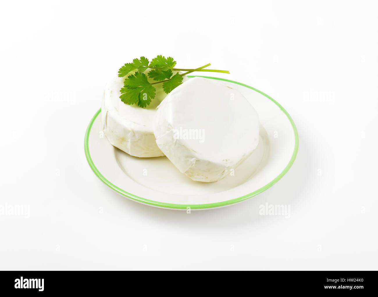 Wheels of soft ripened cheese with white mold rind Stock Photo - Alamy
