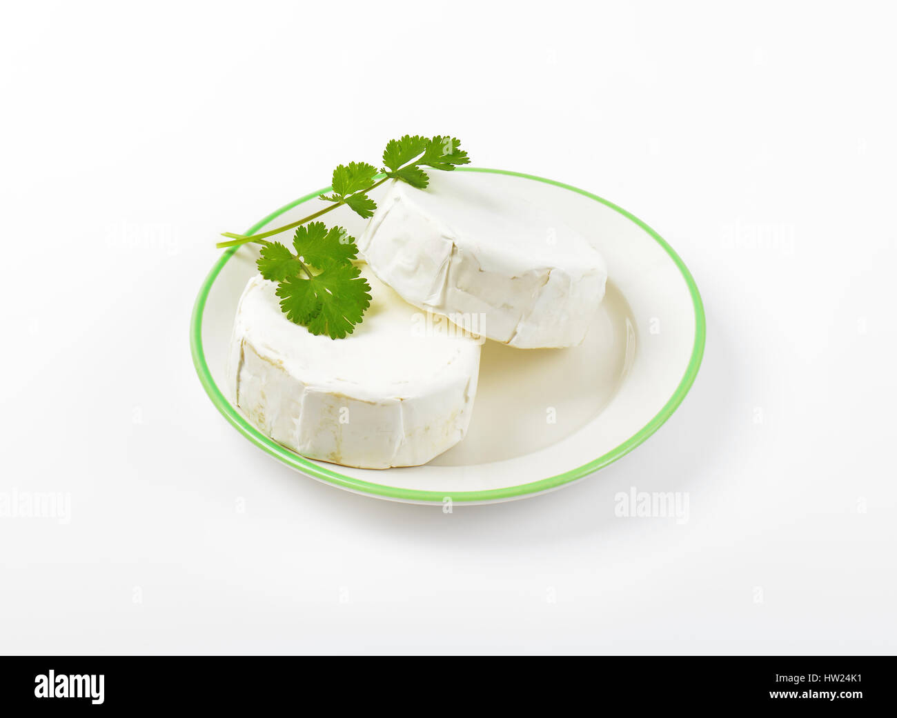 Wheels of soft ripened cheese with white mold rind Stock Photo - Alamy