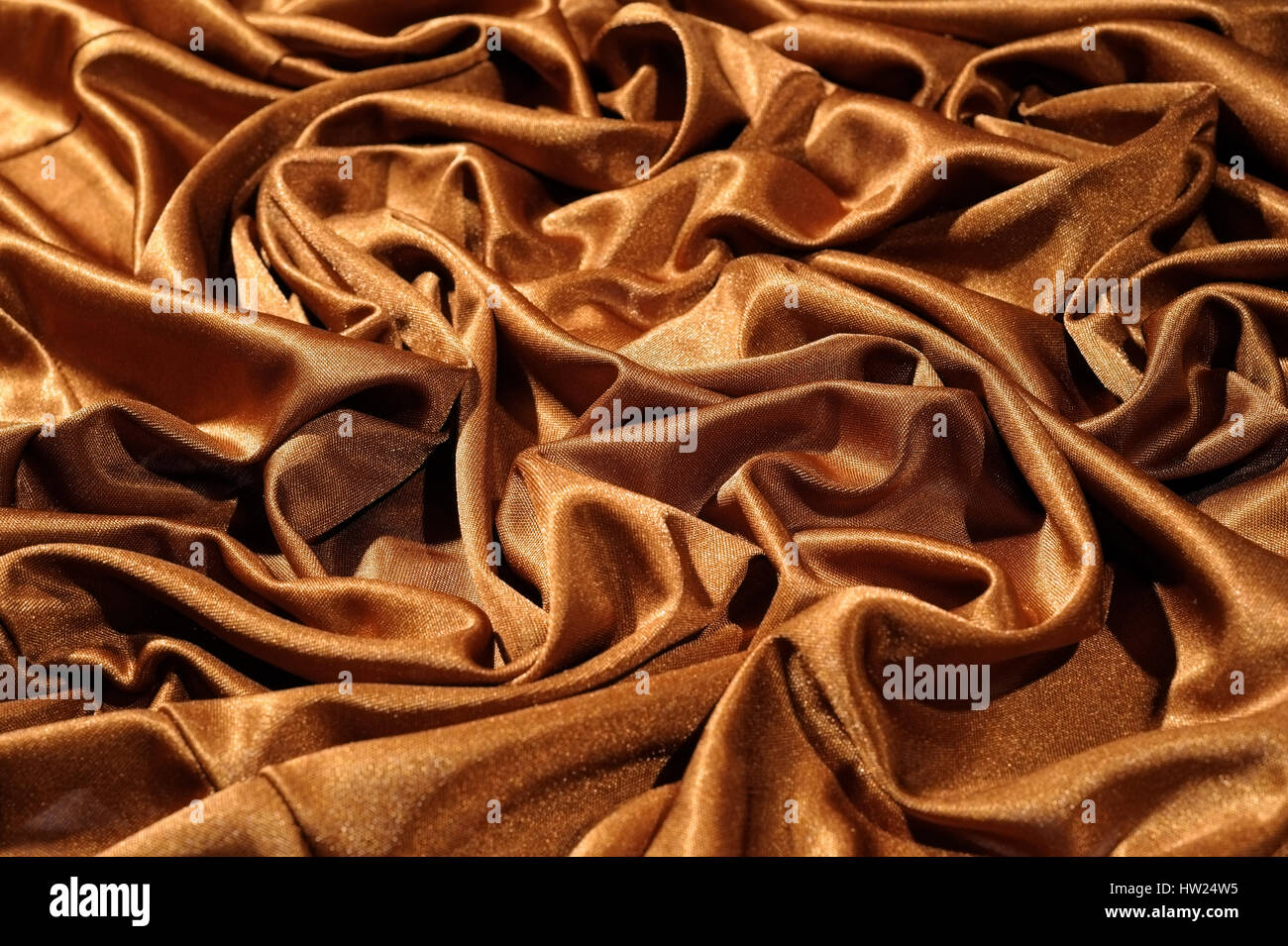 Cloth background in golden color Stock Photo - Alamy