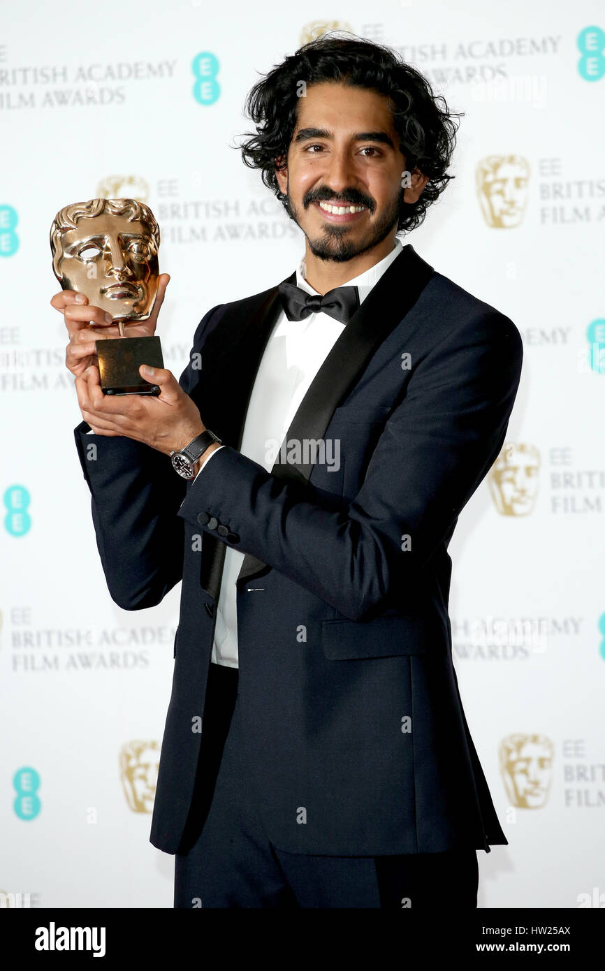 Dev Patel, winner of the best supporting actor award, poses in the ...