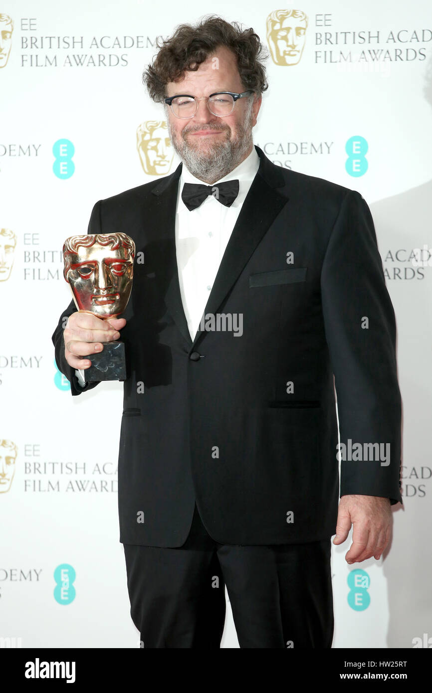 Kenneth Lonergan, with his best original screenplay award, poses in the ...