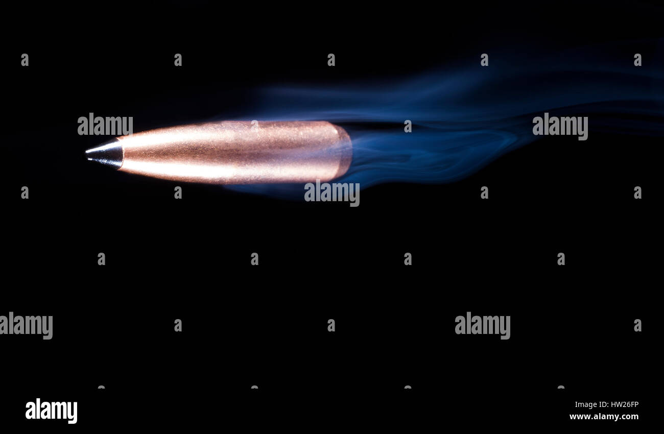 Copper plated bullet with a polymer tip and smoke trailing Stock Photo ...