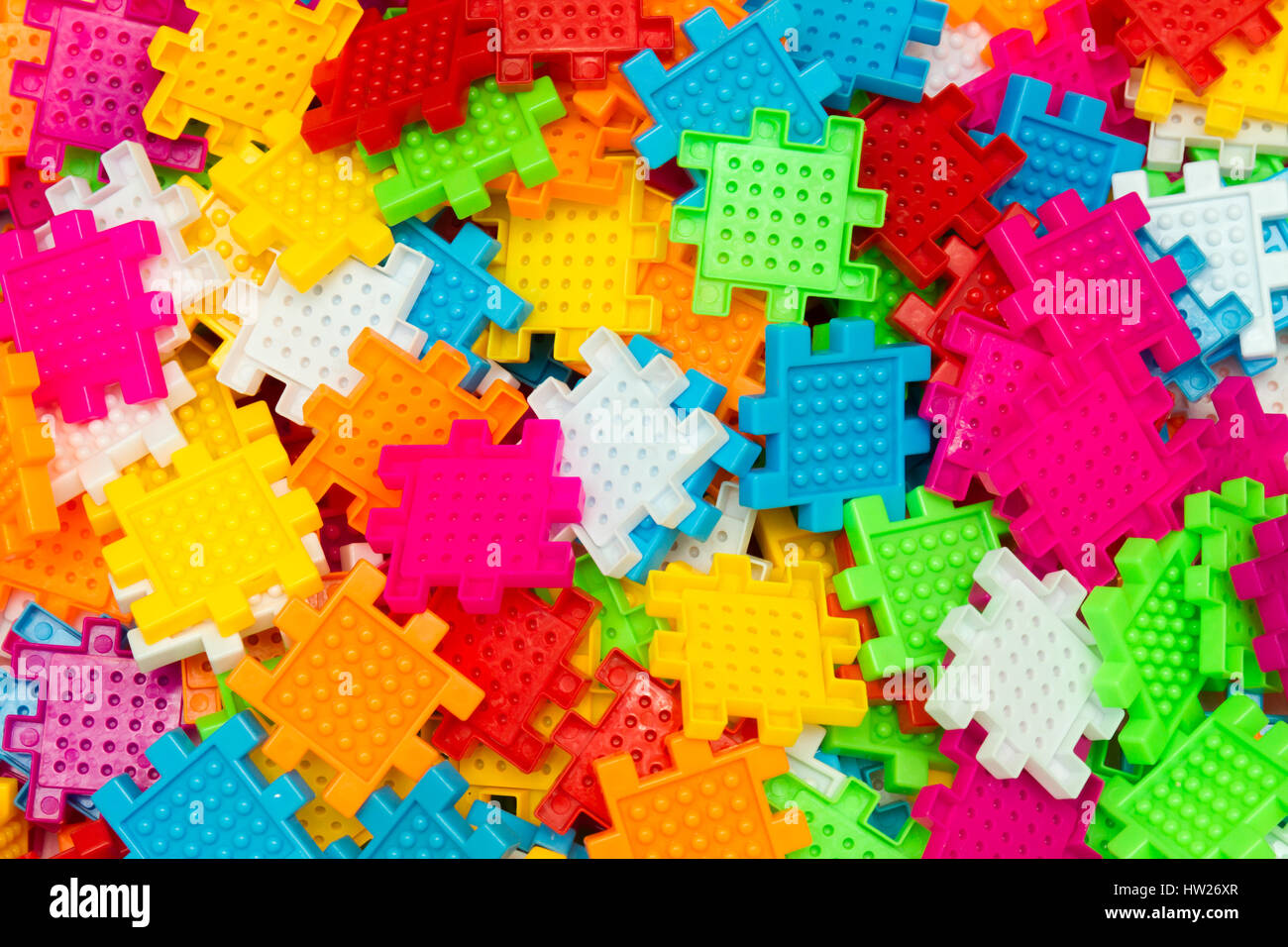 Some colorful jigsaw puzzle pieces close up Stock Photo - Alamy