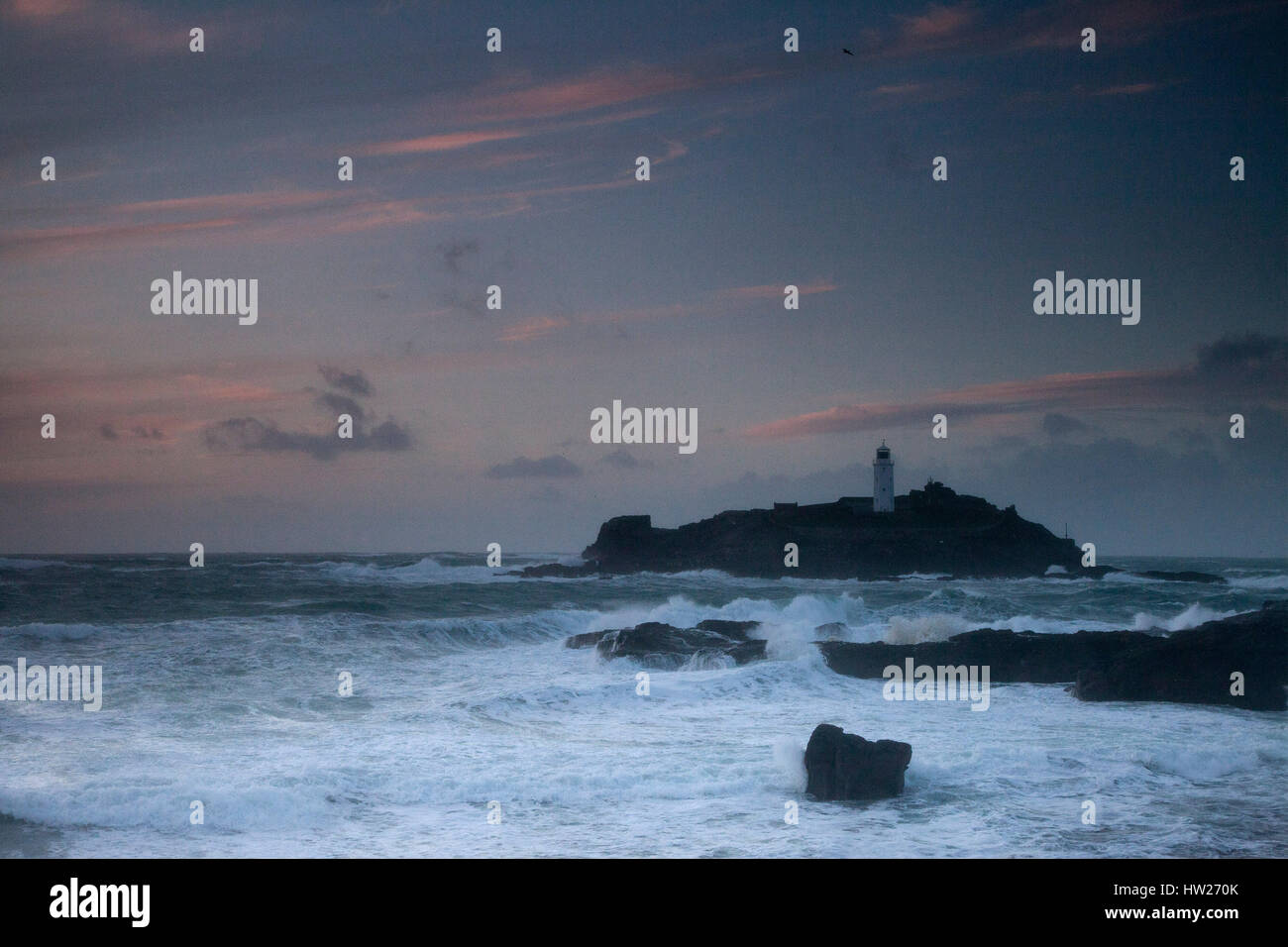 Lighthouse in breaking waves hi-res stock photography and images - Alamy