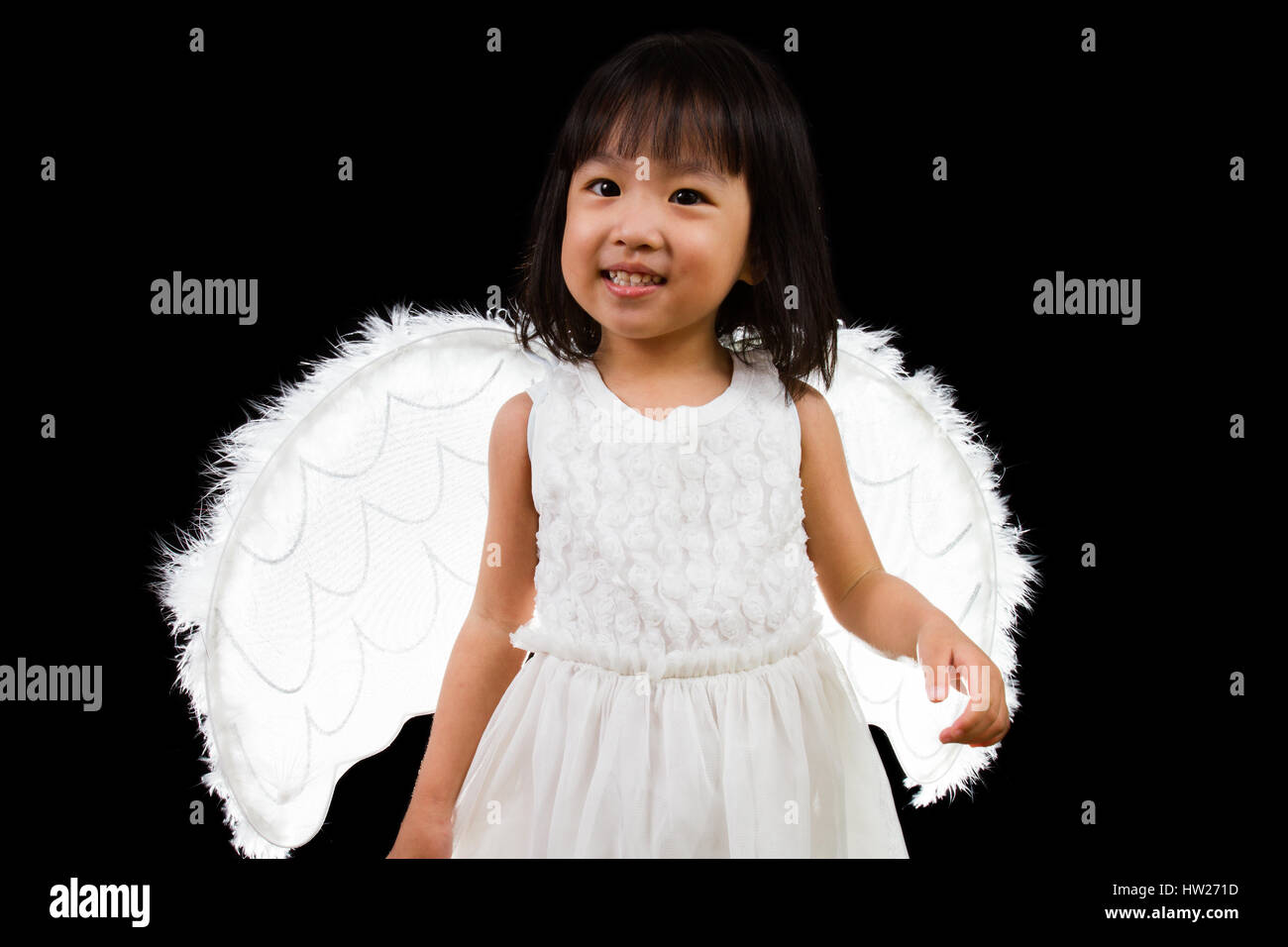 Asian Chinese Little Angel in black background studio shot Stock Photo ...