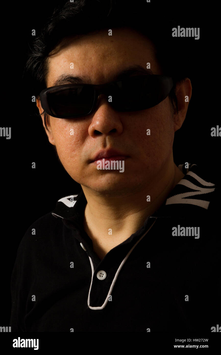 Chinese man posing gangster portrait hi-res stock photography and ...