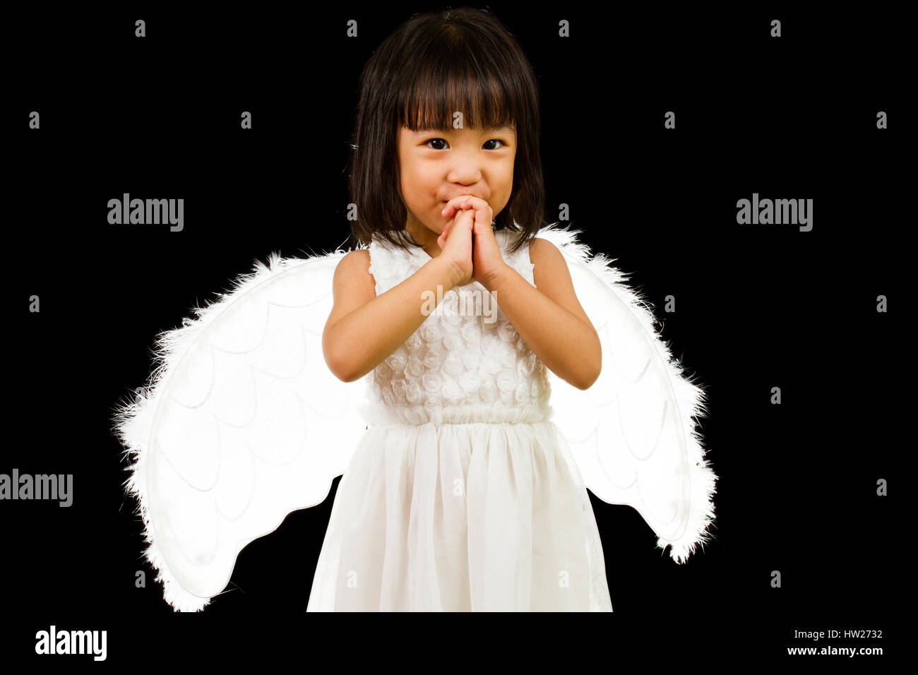 Asian Chinese Little Angel in black background studio shot Stock Photo ...