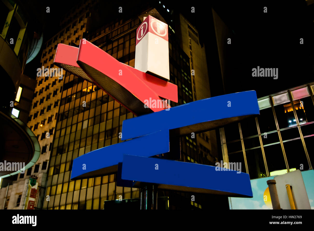 Blank directional road signs on street at night Stock Photo - Alamy