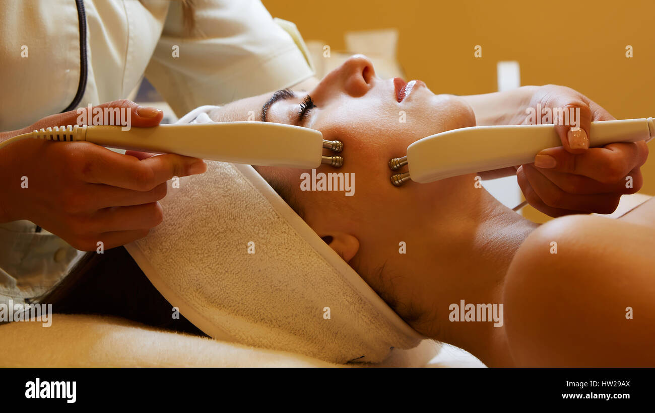 Cosmetology. Beautiful Woman At Spa Clinic Receiving Stimulating ...