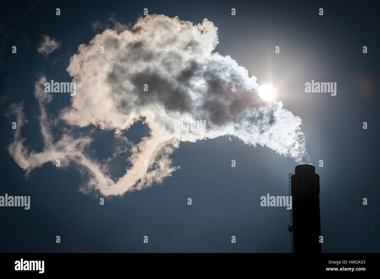 smoke chimney factory in sunset Stock Photo - Alamy