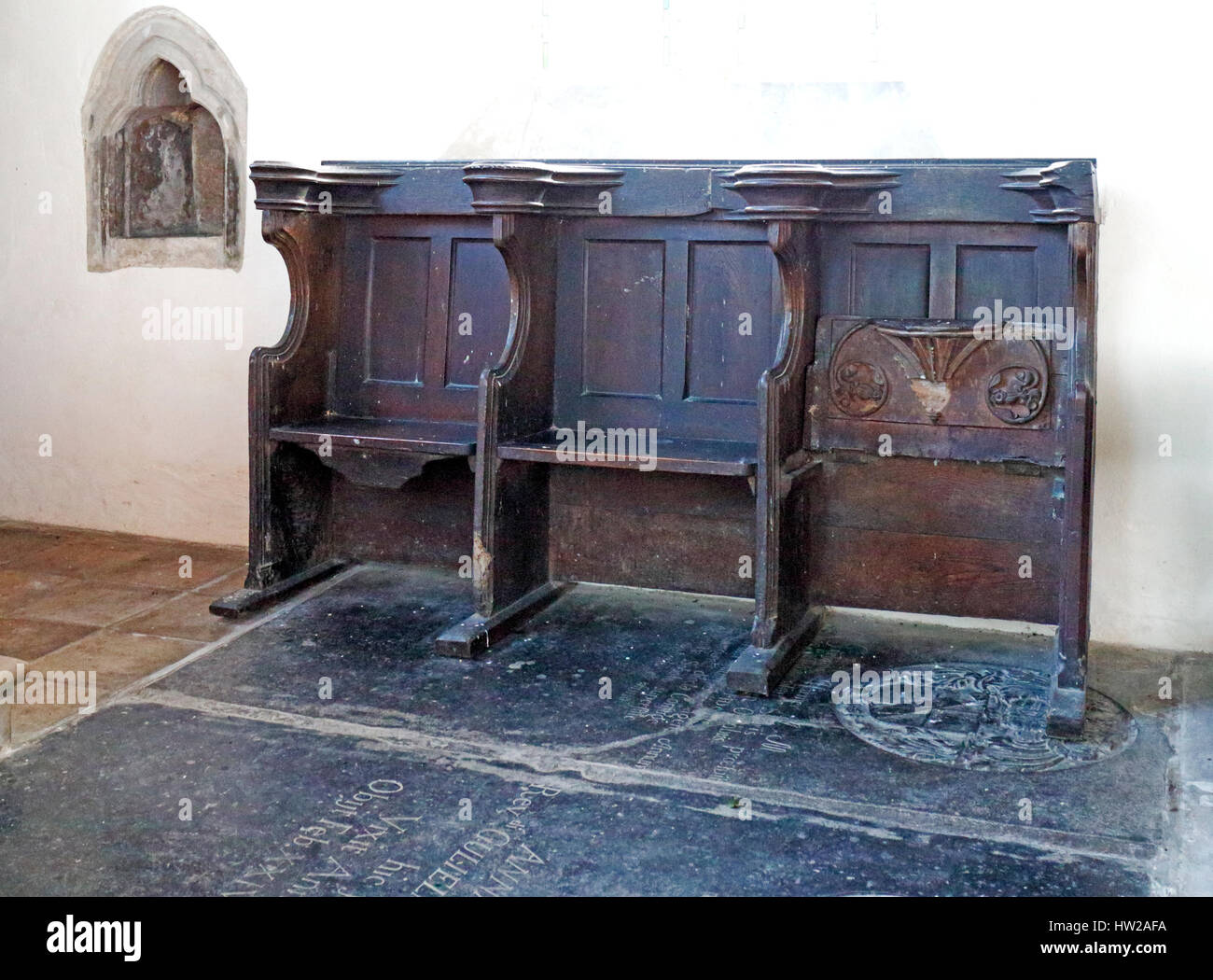 A view of the piscina and misericord seats in the parish church at ...