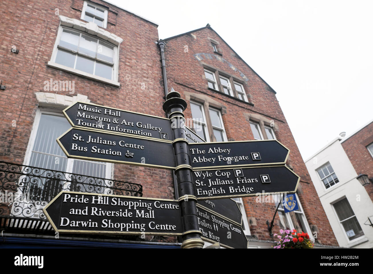 Signs on signnpost with directions to tourist sites and places of ...