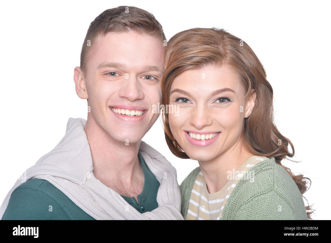 Beautiful young couple on a white background Stock Photo - Alamy
