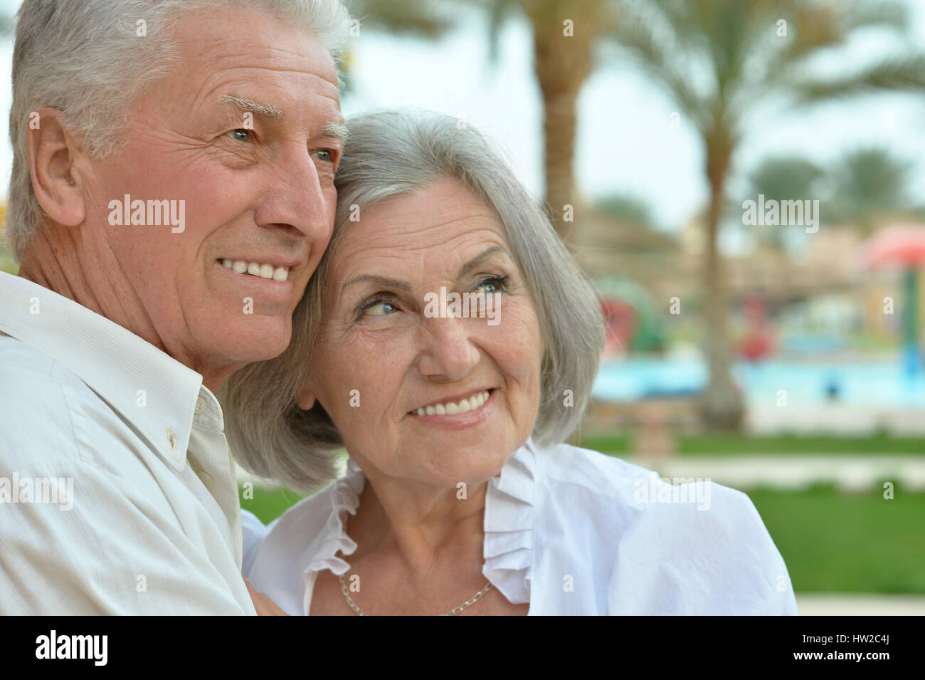 Happy elderly couple embracing Stock Photo - Alamy