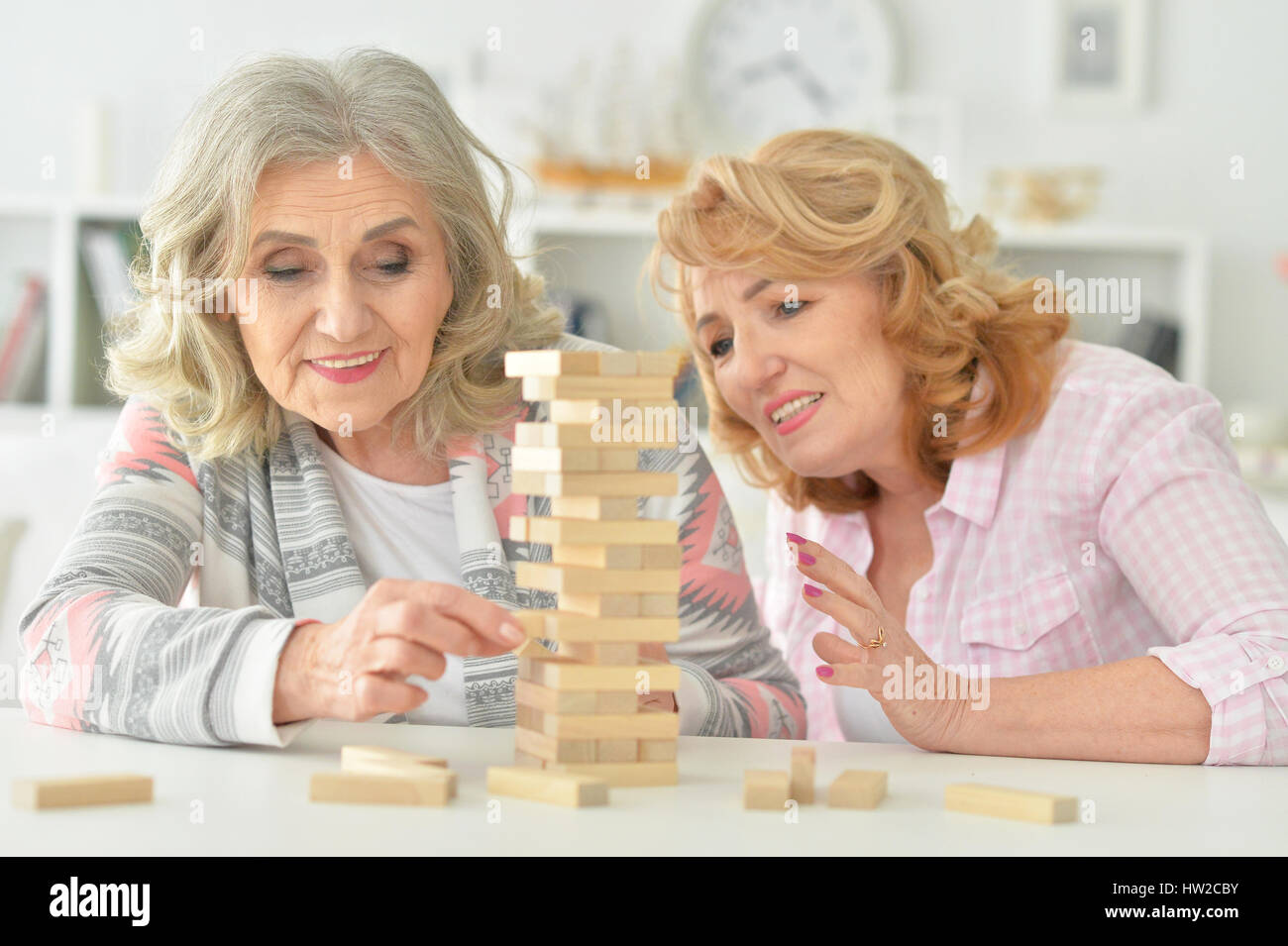 Elderly people playing a board game Stock Photo - Alamy
