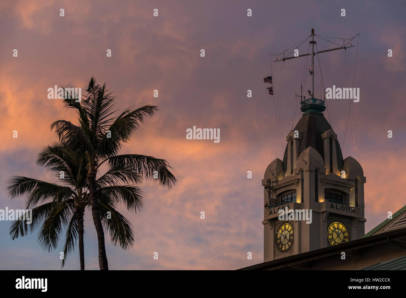 A view of the Aloha tower at sunset from the Honolulu harbor Stock ...