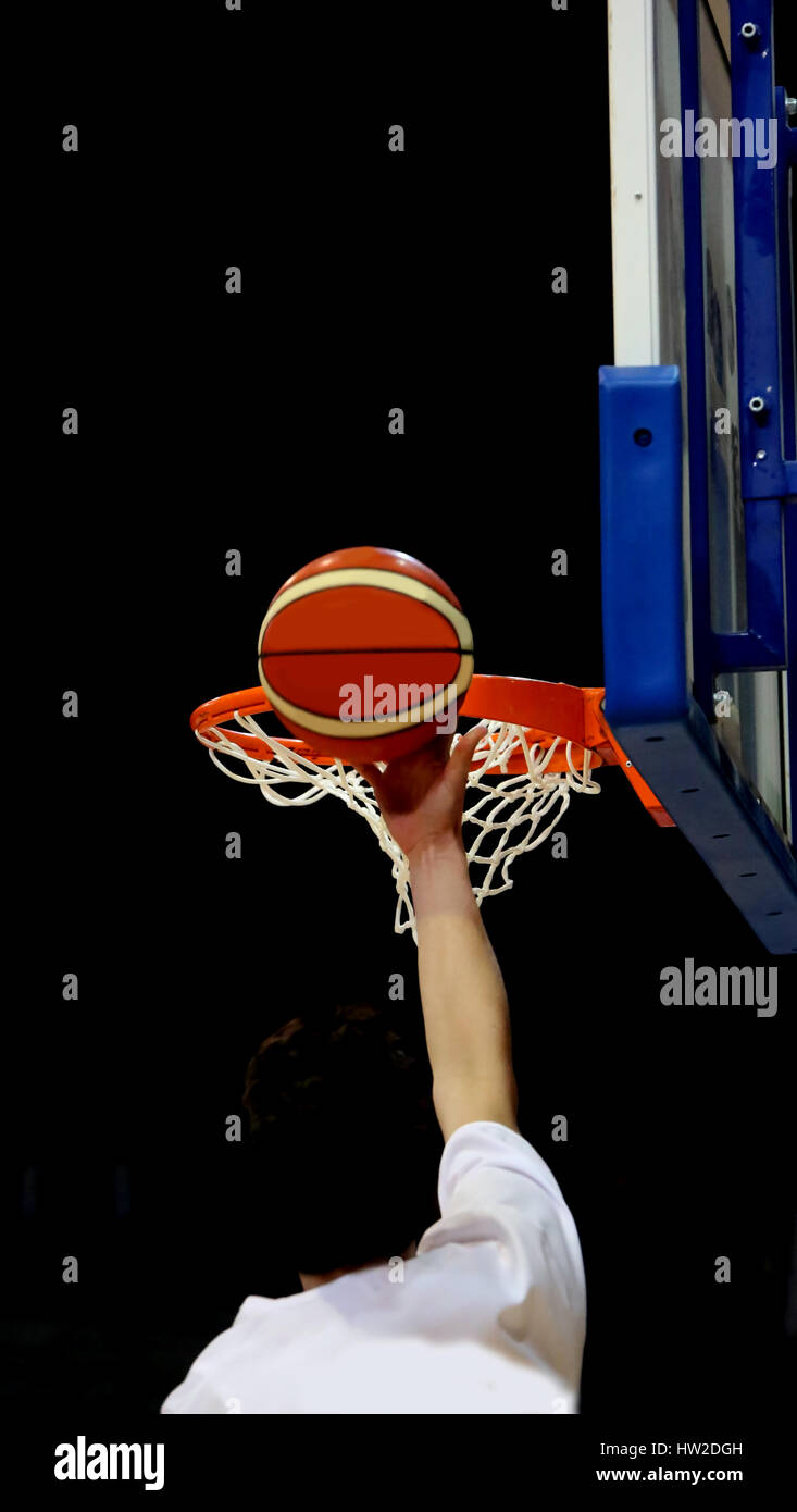 basketball player during the crushing of the basket with the basketball ...
