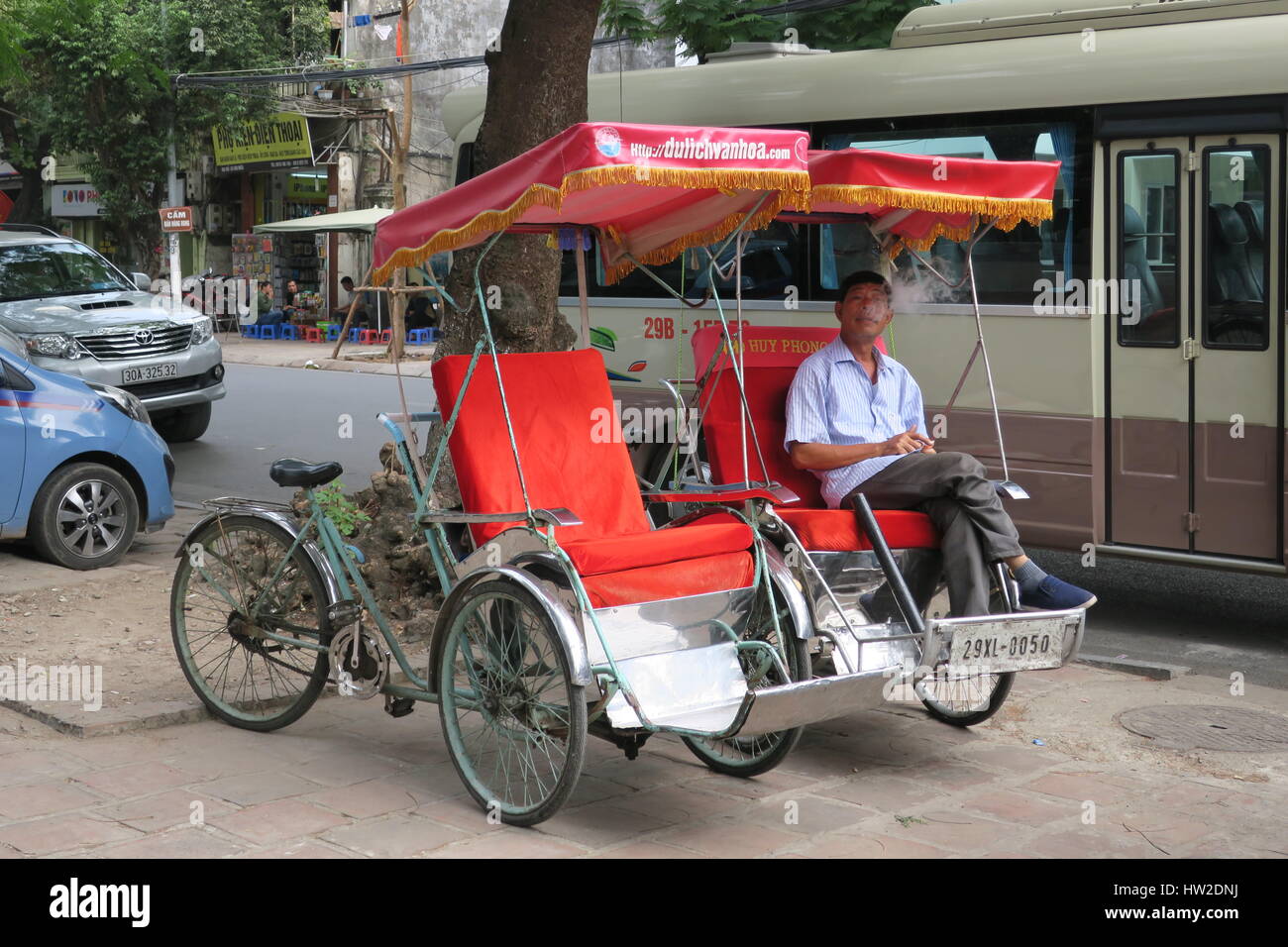 Bicycle rickshaw taxi tricycle in Hanoi, Vietnam Stock Photo - Alamy