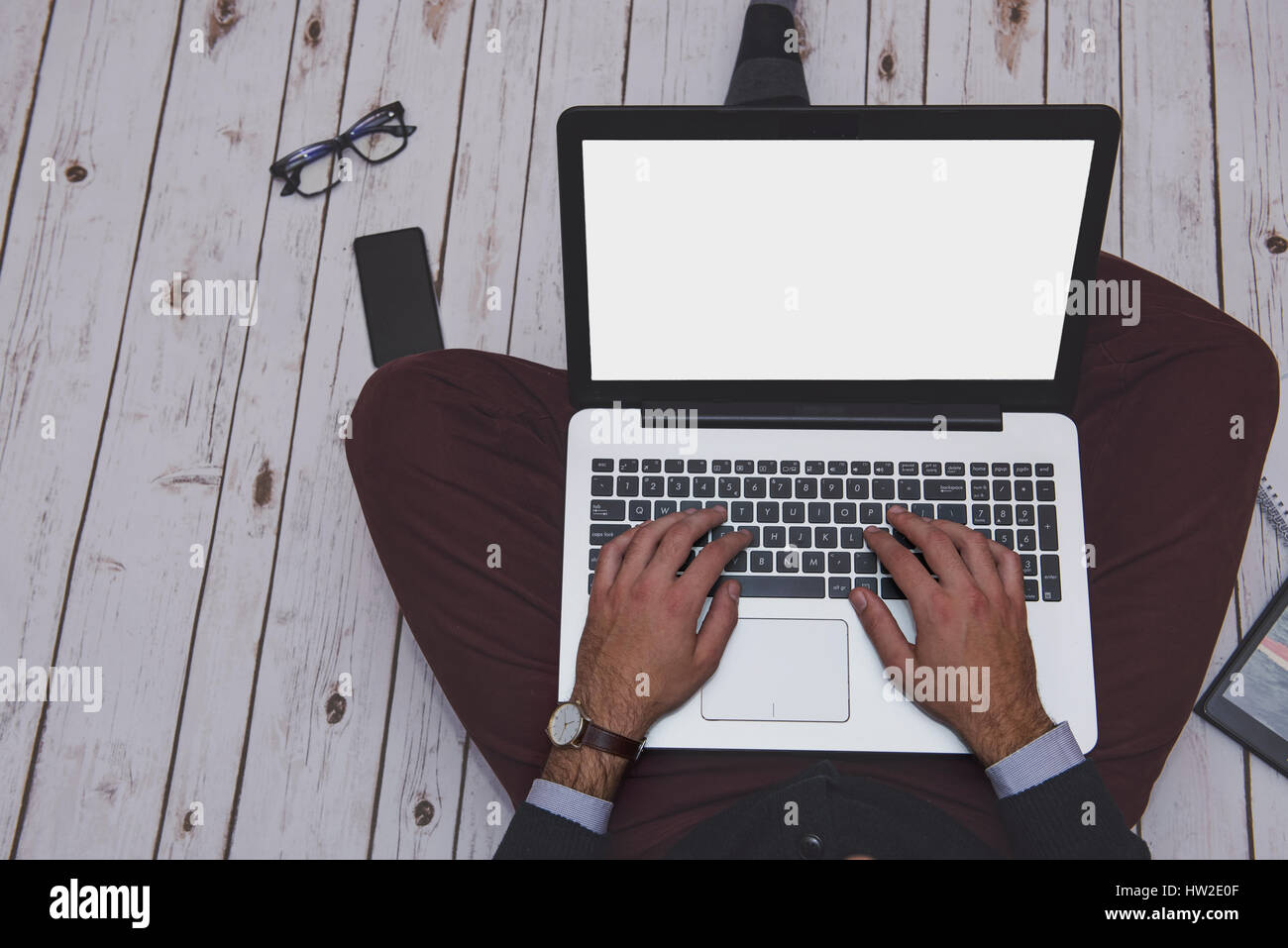 Man with a laptop working - copy space Stock Photo - Alamy