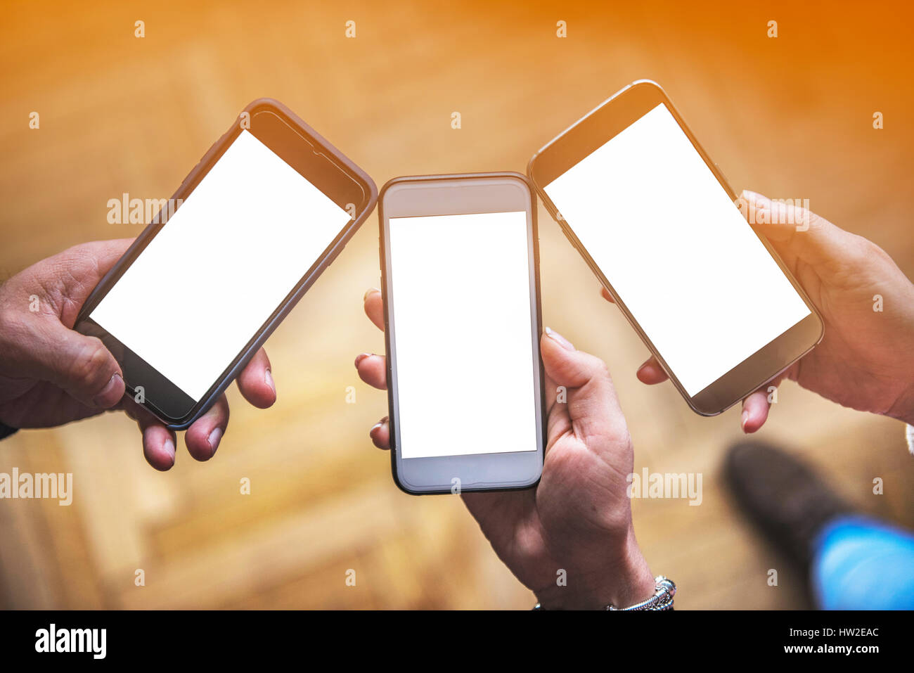Hands holding smart phones hi-res stock photography and images - Alamy