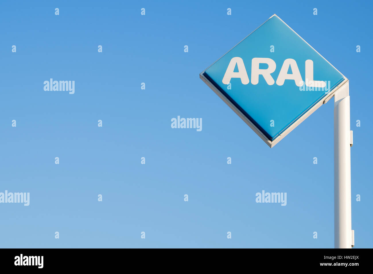 Aral sign against blue sky. Aral is a brand of automobile fuels and ...