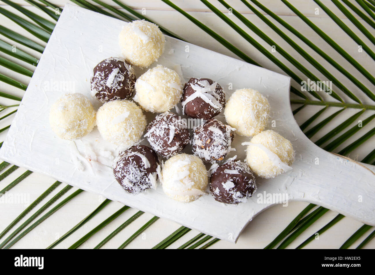 Coconut candy on a white wooden tray Stock Photo - Alamy