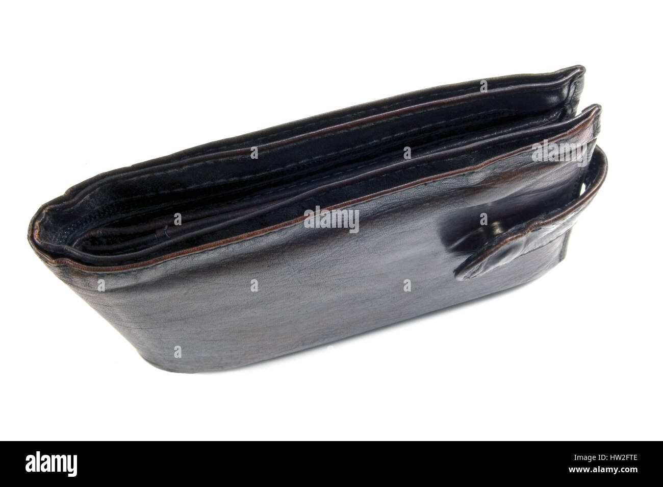 Old worn grungy black grunge leather wallet, isolated vertical closeup ...