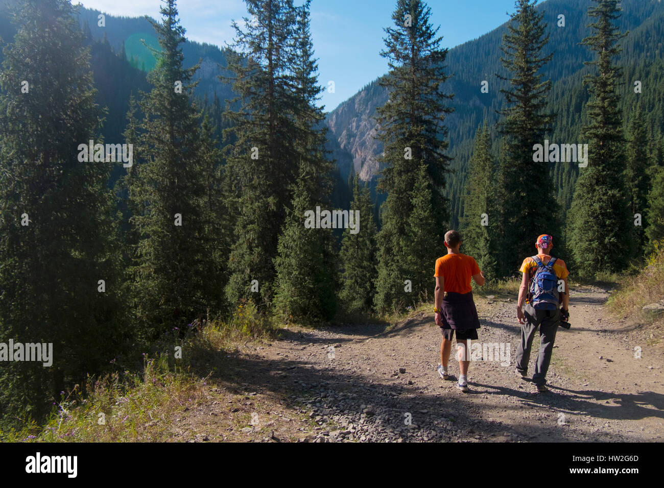 Caucasian men hiking on path in mountains Stock Photo - Alamy