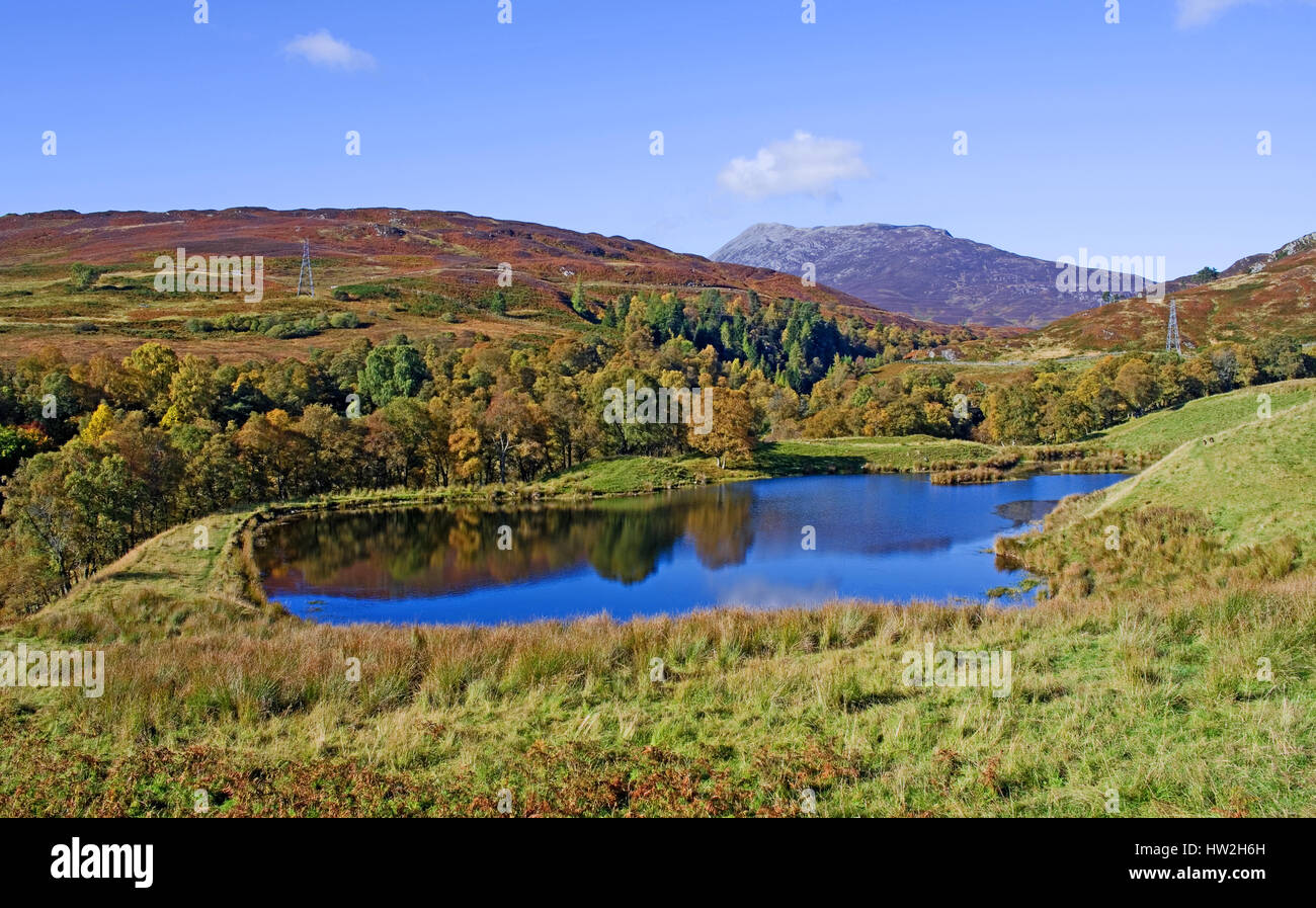 Schiehallion seen across a small lochan at Glengoulandie in Highland ...