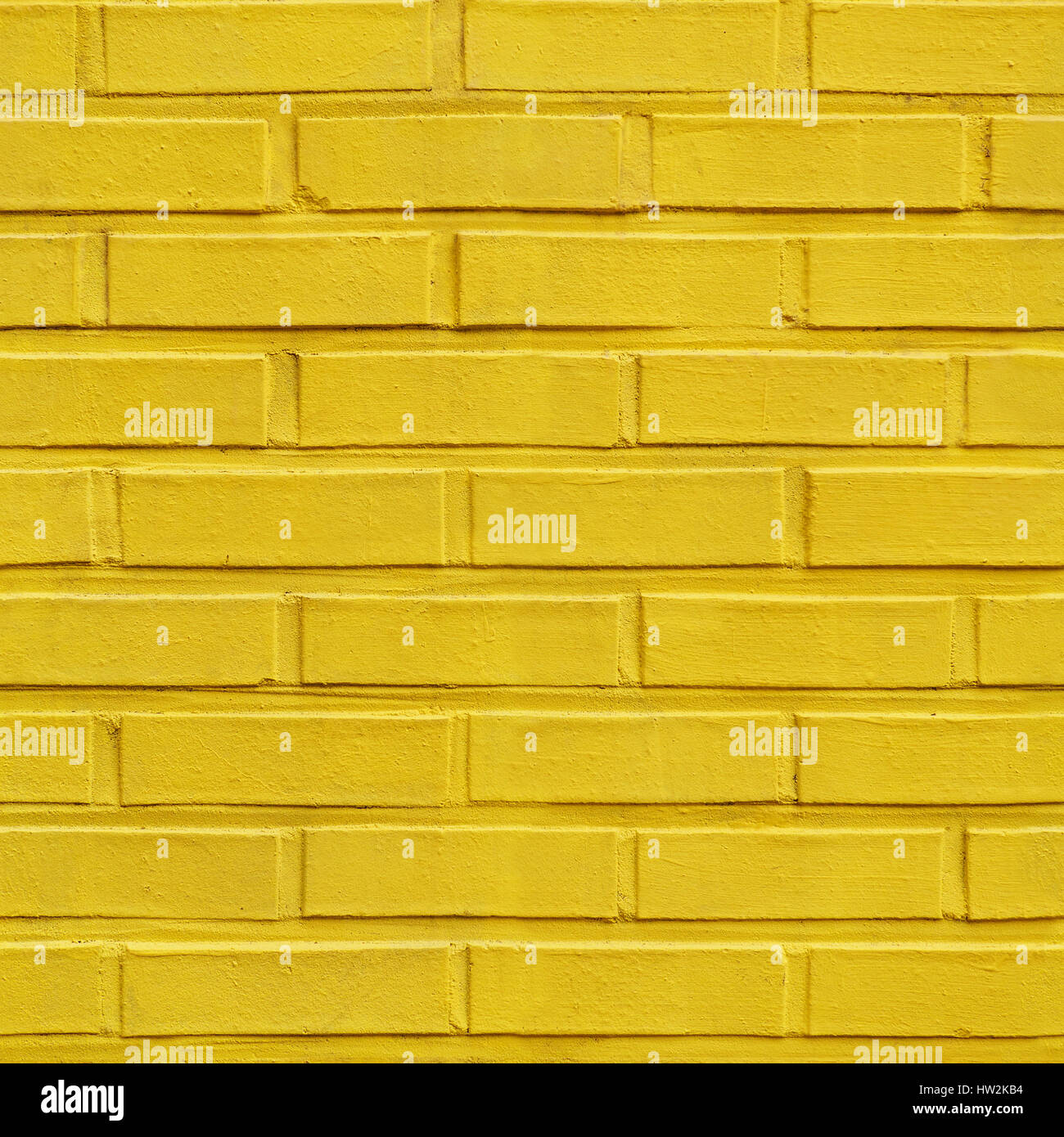 Yellow brick pattern wall Stock Photo - Alamy