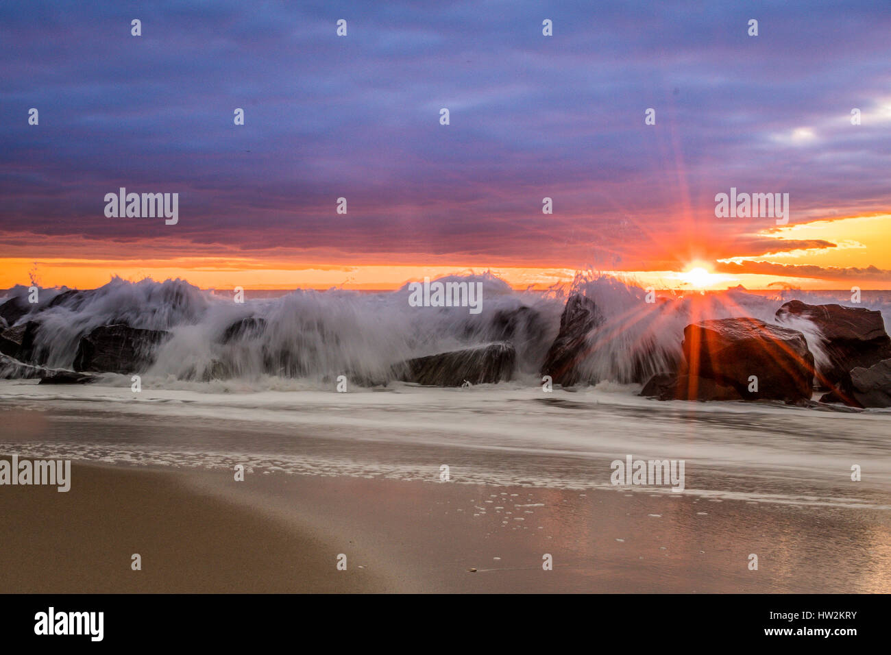 Sun rising on a windy day Stock Photo - Alamy