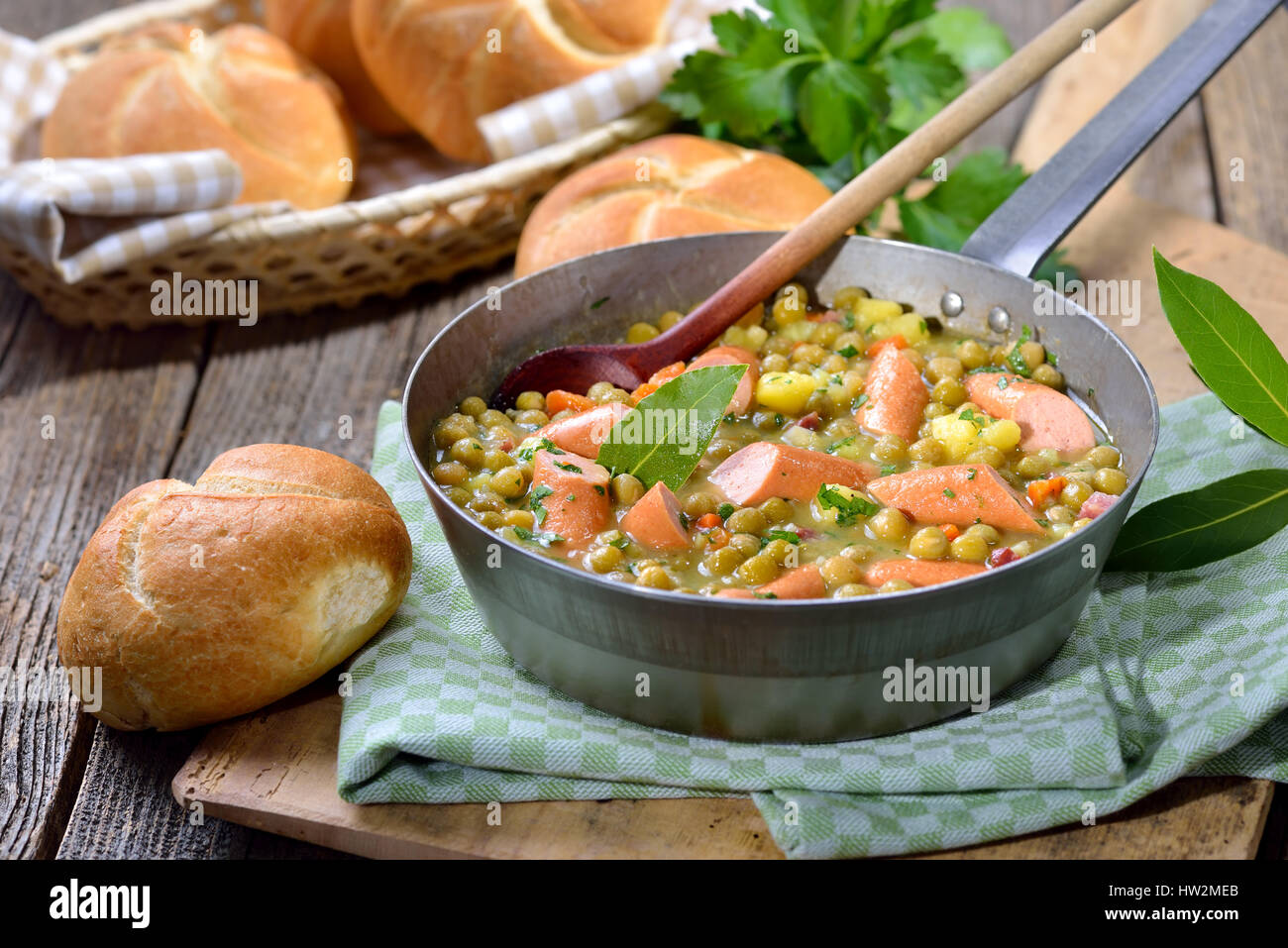 Hearty pea stew with potatoes, bacon and Vienna sausages Stock Photo ...