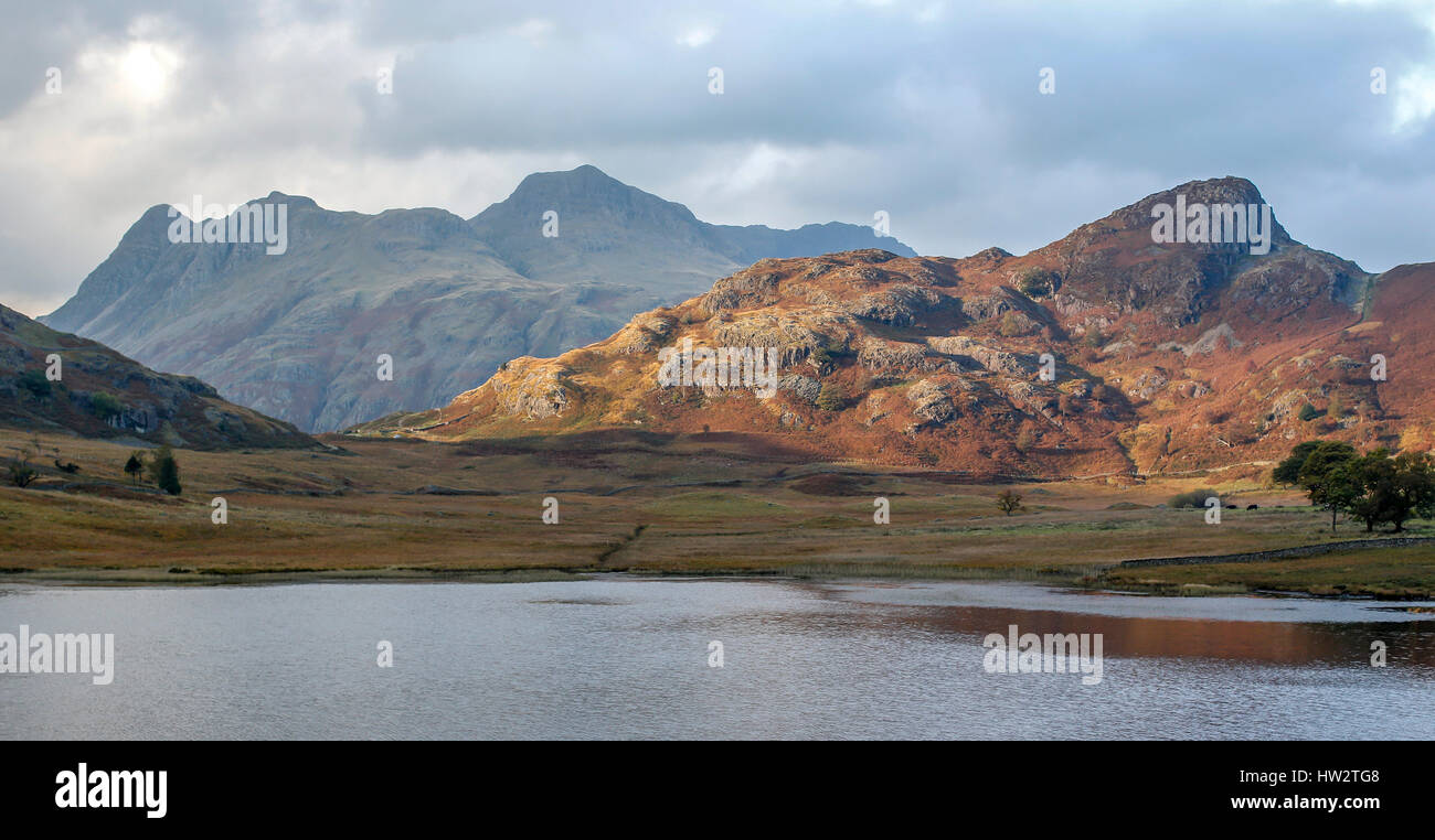 View looking over Blea Tarn, at sunset, with Side Pike on the right ...