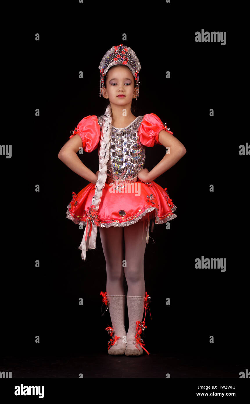 Cute little girl wearing native russian costume isolated on black ...