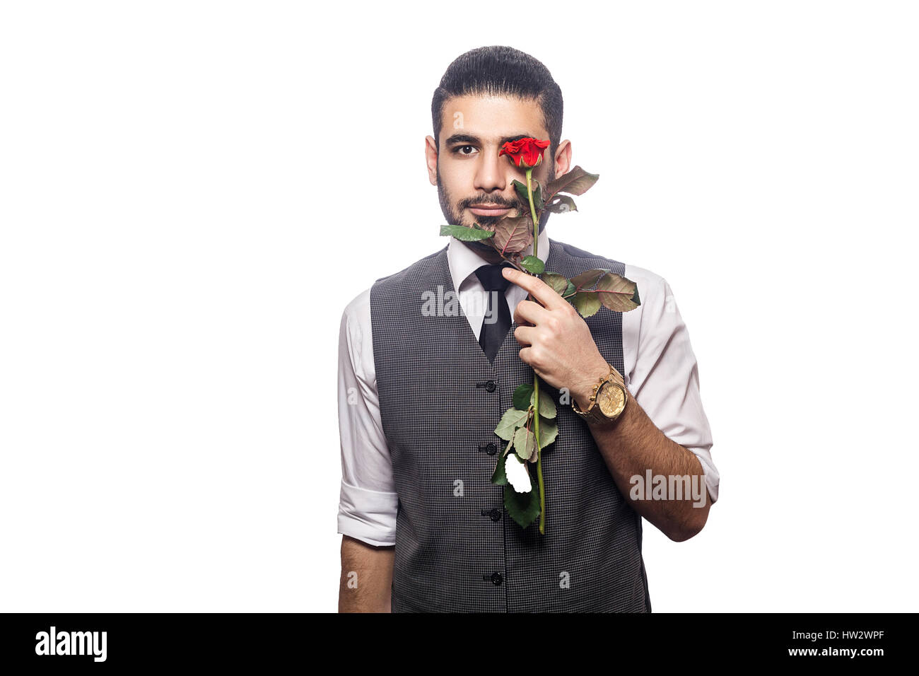 Handsome romantic happy man with rose flower. studio shot. isolated on ...