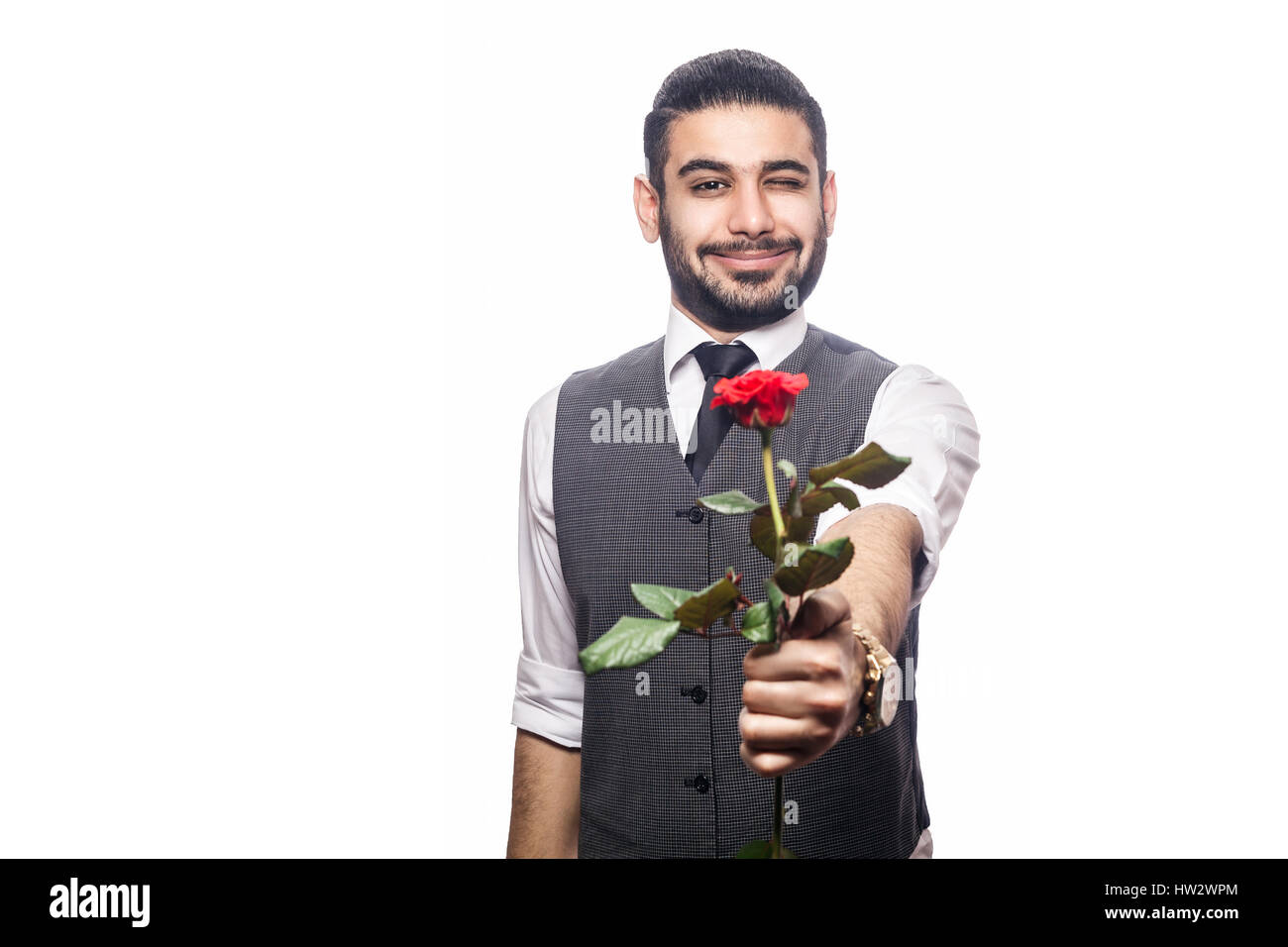 Handsome romantic happy man with rose flower. studio shot. isolated on ...