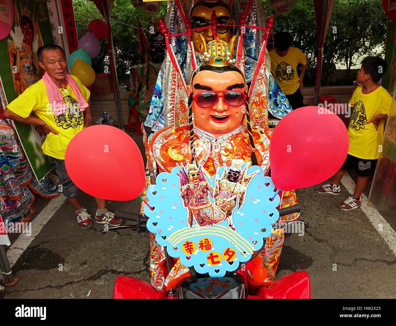 KAOHSIUNG, TAIWAN -- AUGUST 15, 2015: A masked dancer in a modernized ...