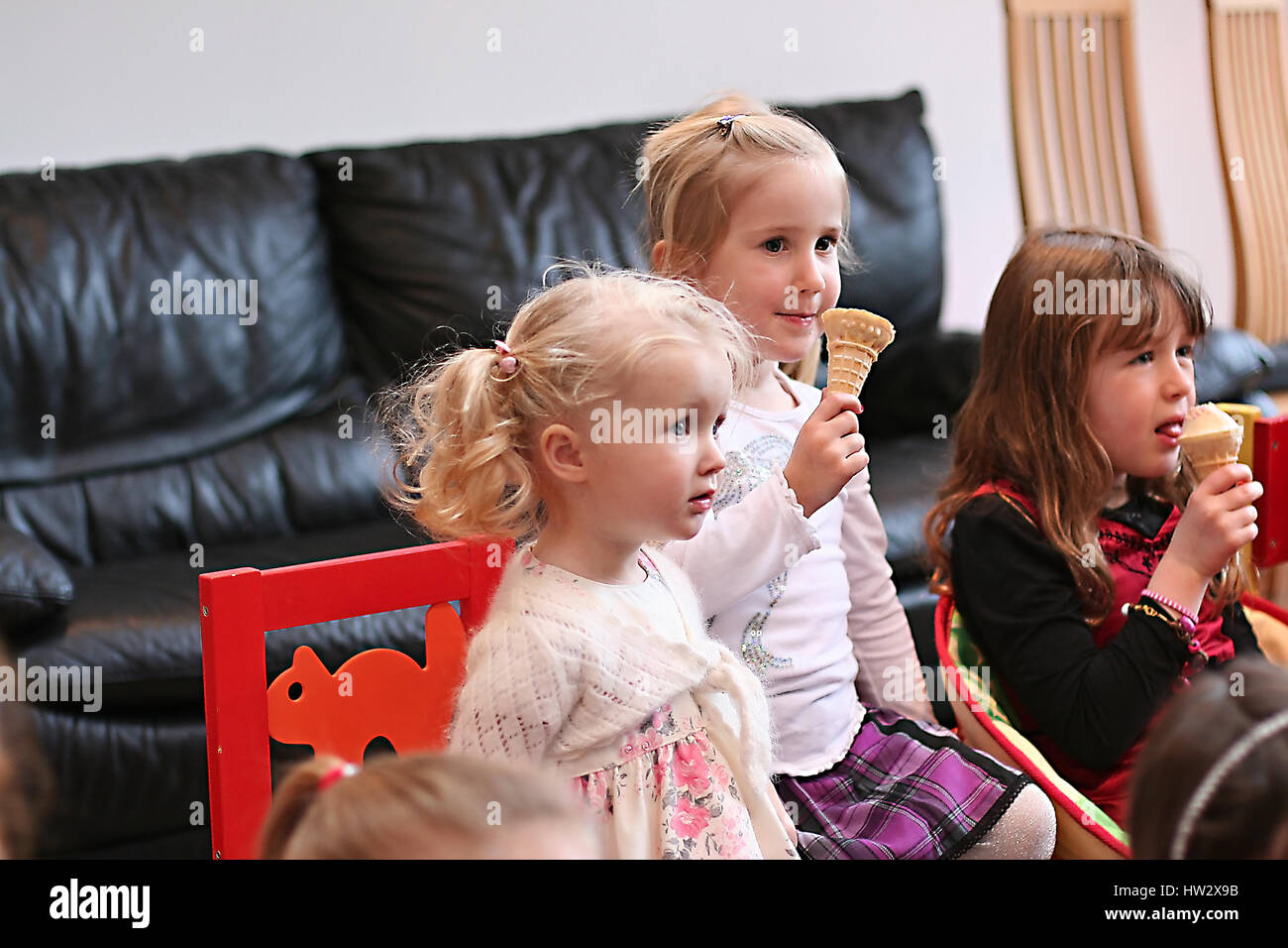 Excited children watching party magician at a children's birthday party ...