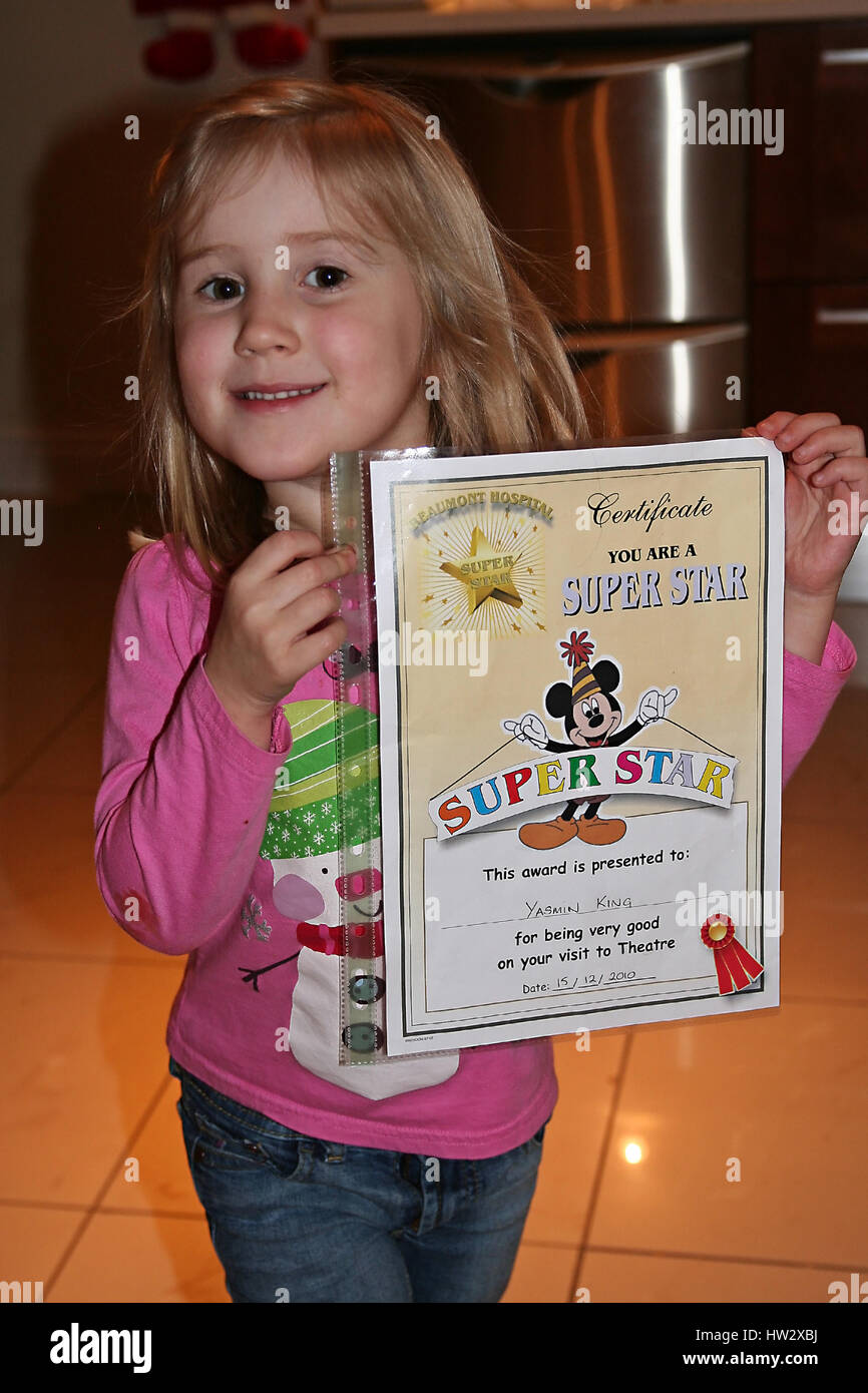 Little girl with congratulations certificate award, achievement, child ...