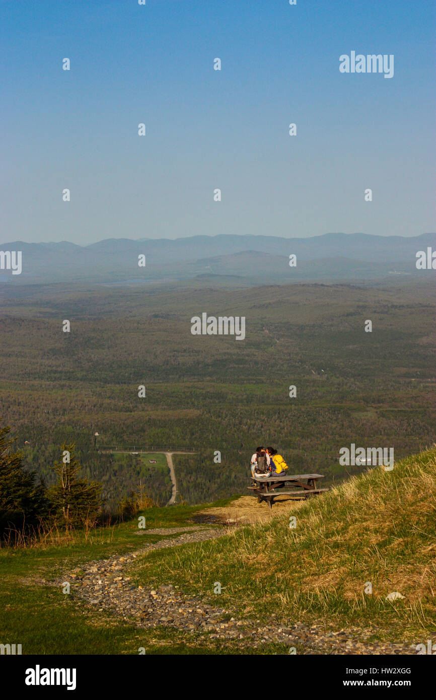 two hikers sitting on a picnic table with a great view Stock Photo - Alamy