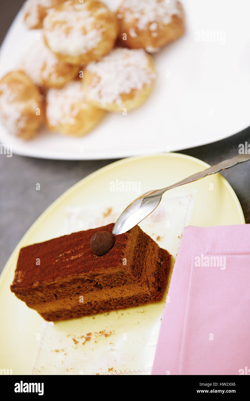 Chocolate cake and eclairs. View from above Stock Photo - Alamy