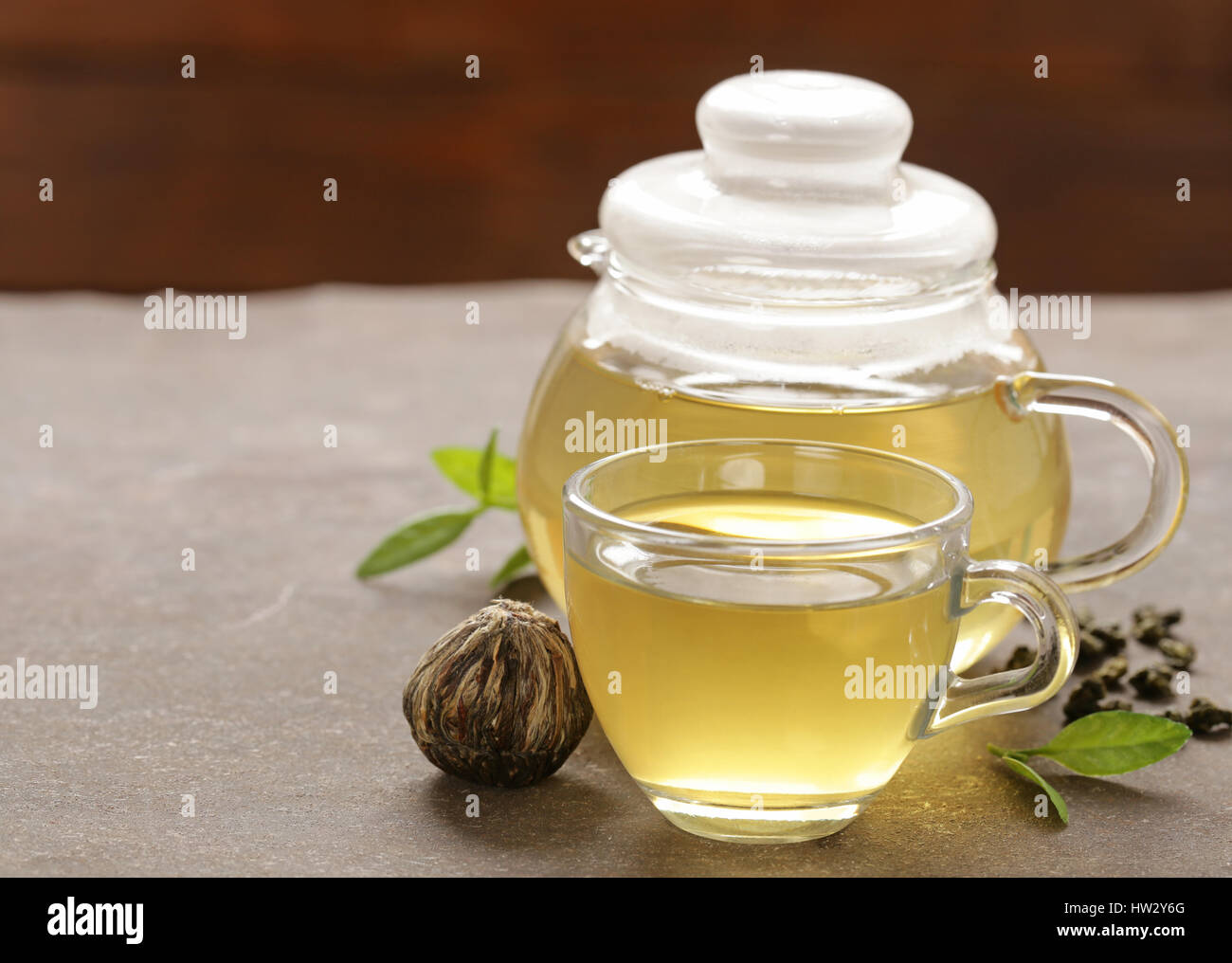 Traditional green tea in a kettle on the table Stock Photo - Alamy