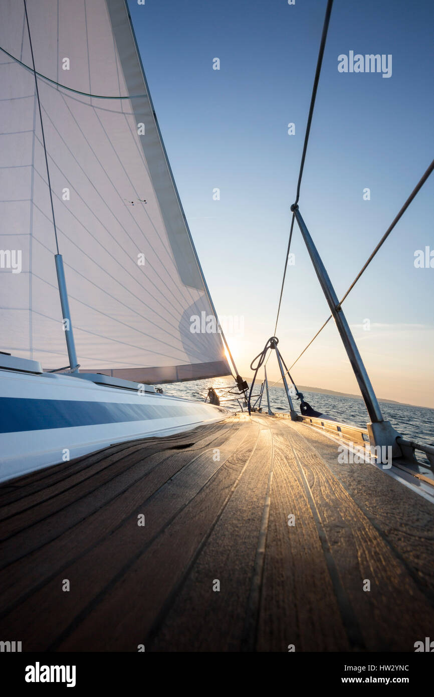 Surface level of boat deck in sea during sunset Stock Photo - Alamy