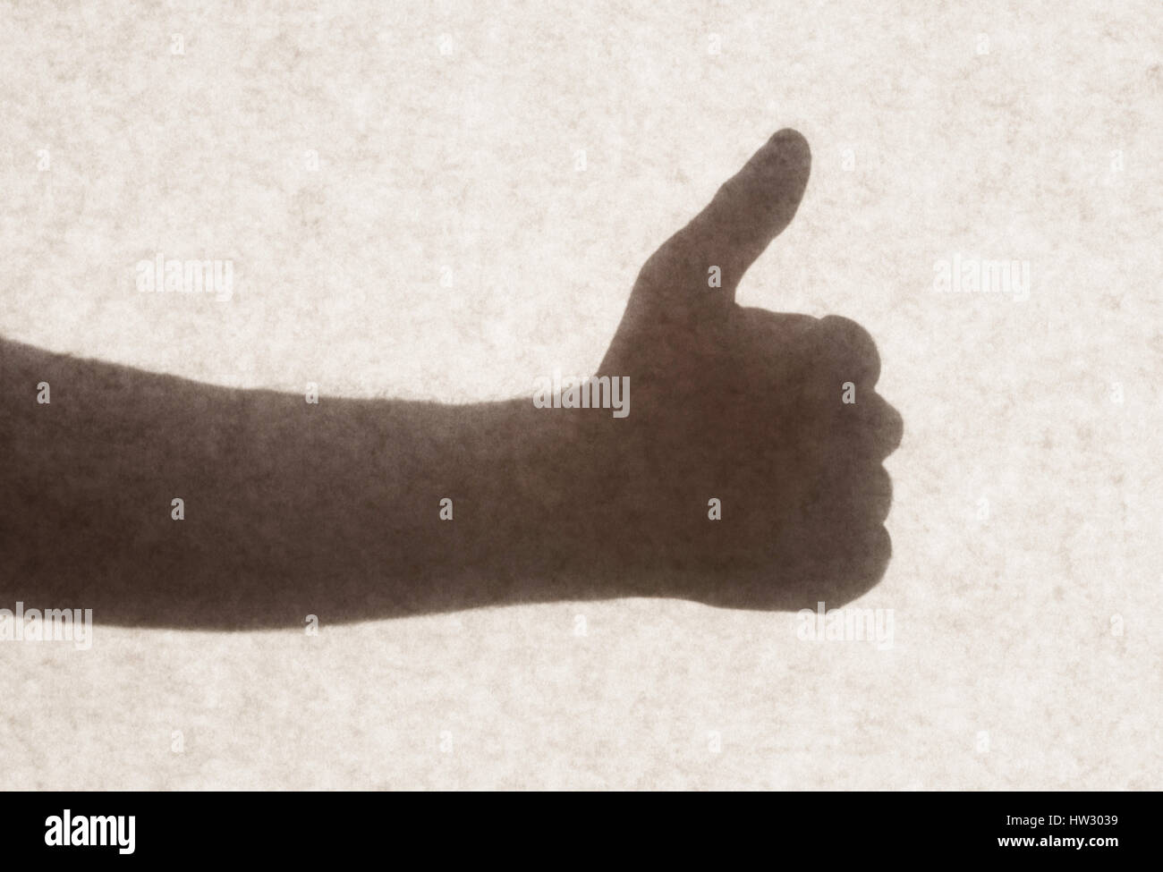 Silhouette behind a transparent paper - Thumbs up Stock Photo - Alamy