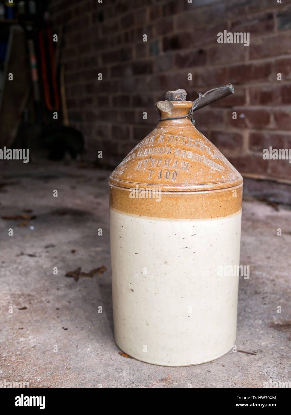 Old stone cider jar. Broken handle. Made in Evesham Stock Photo - Alamy
