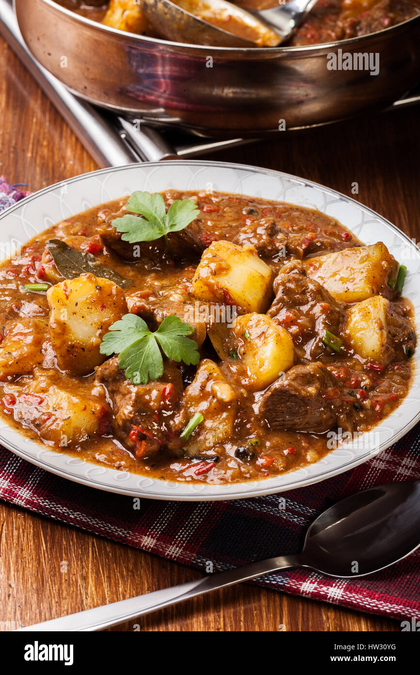 Beef stew with potatoes in a plate Stock Photo - Alamy