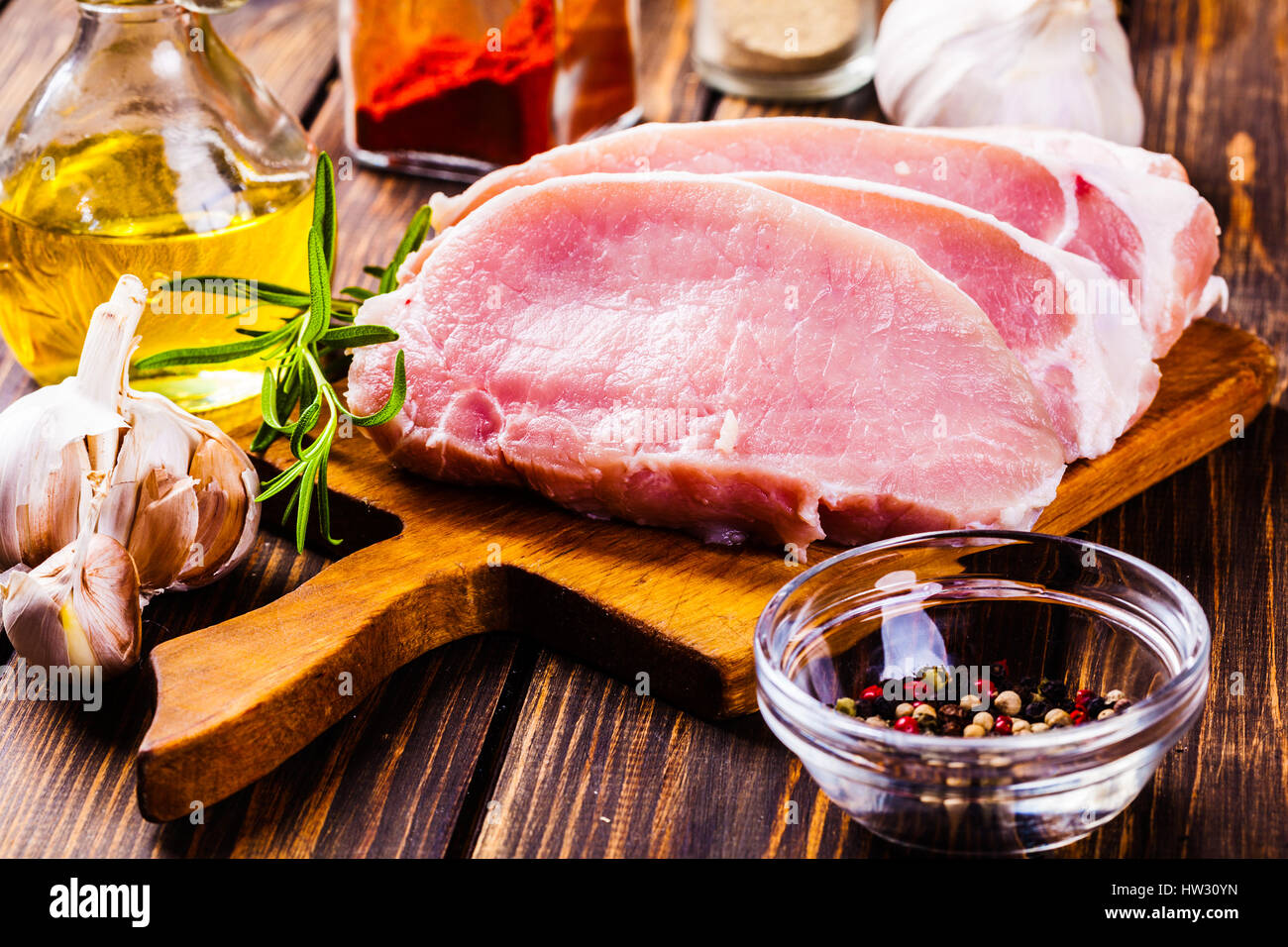 Fresh raw pork slices on a chopping board Stock Photo - Alamy