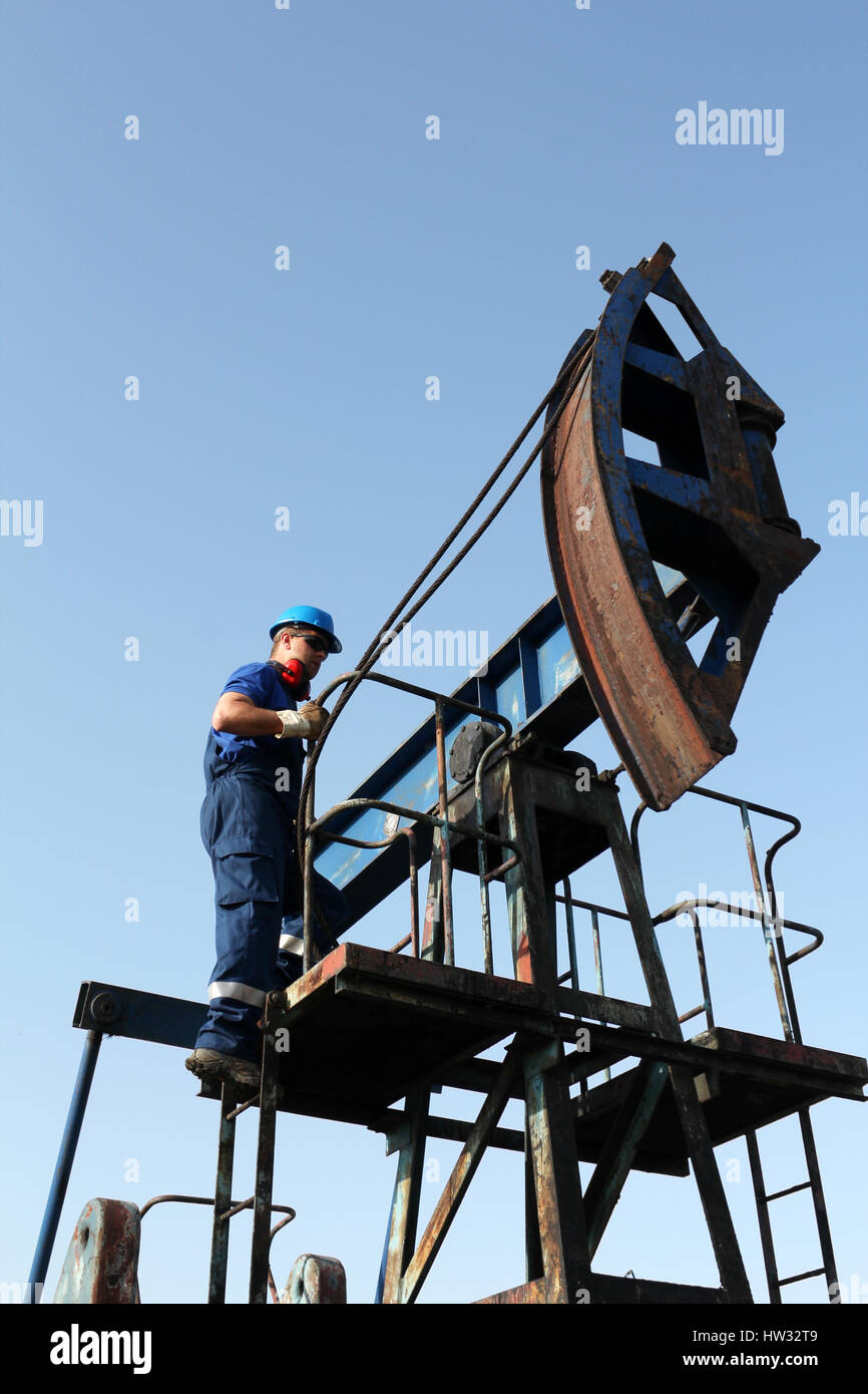 Worker on industrial machine pump hi-res stock photography and images ...